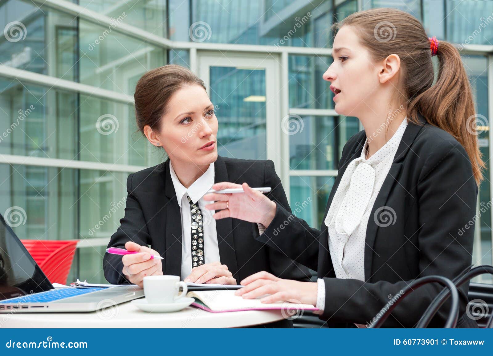 Two young business women stock image. Image of office - 60773901