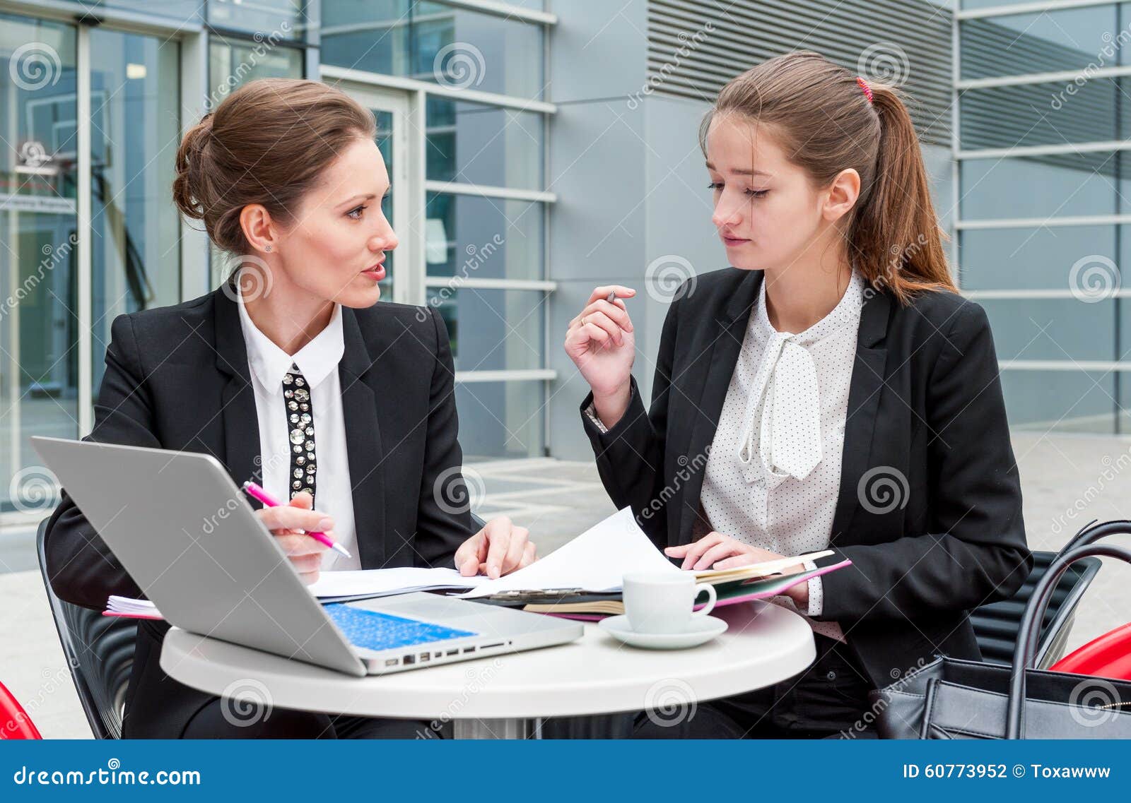 Two young business women stock photo. Image of brainstorming - 60773952