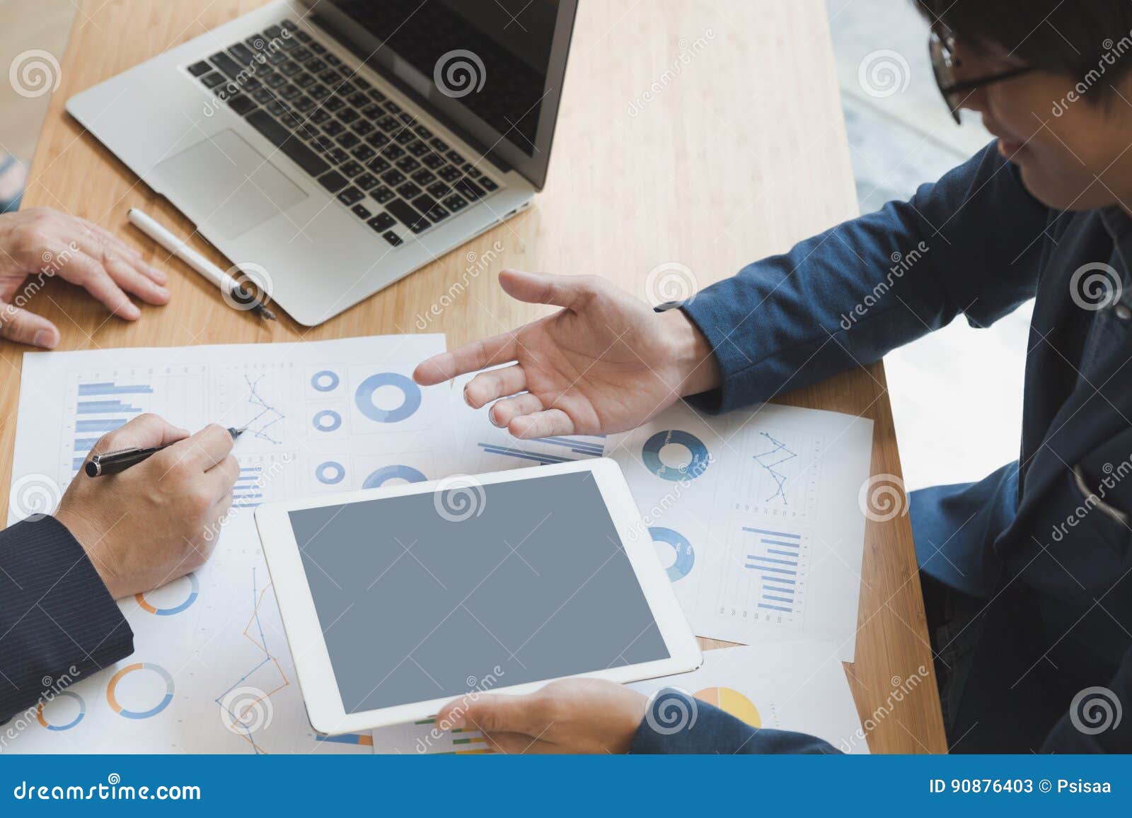 Two Young Businessmen Using Touchpad and Analysis Business Chart Stock ...