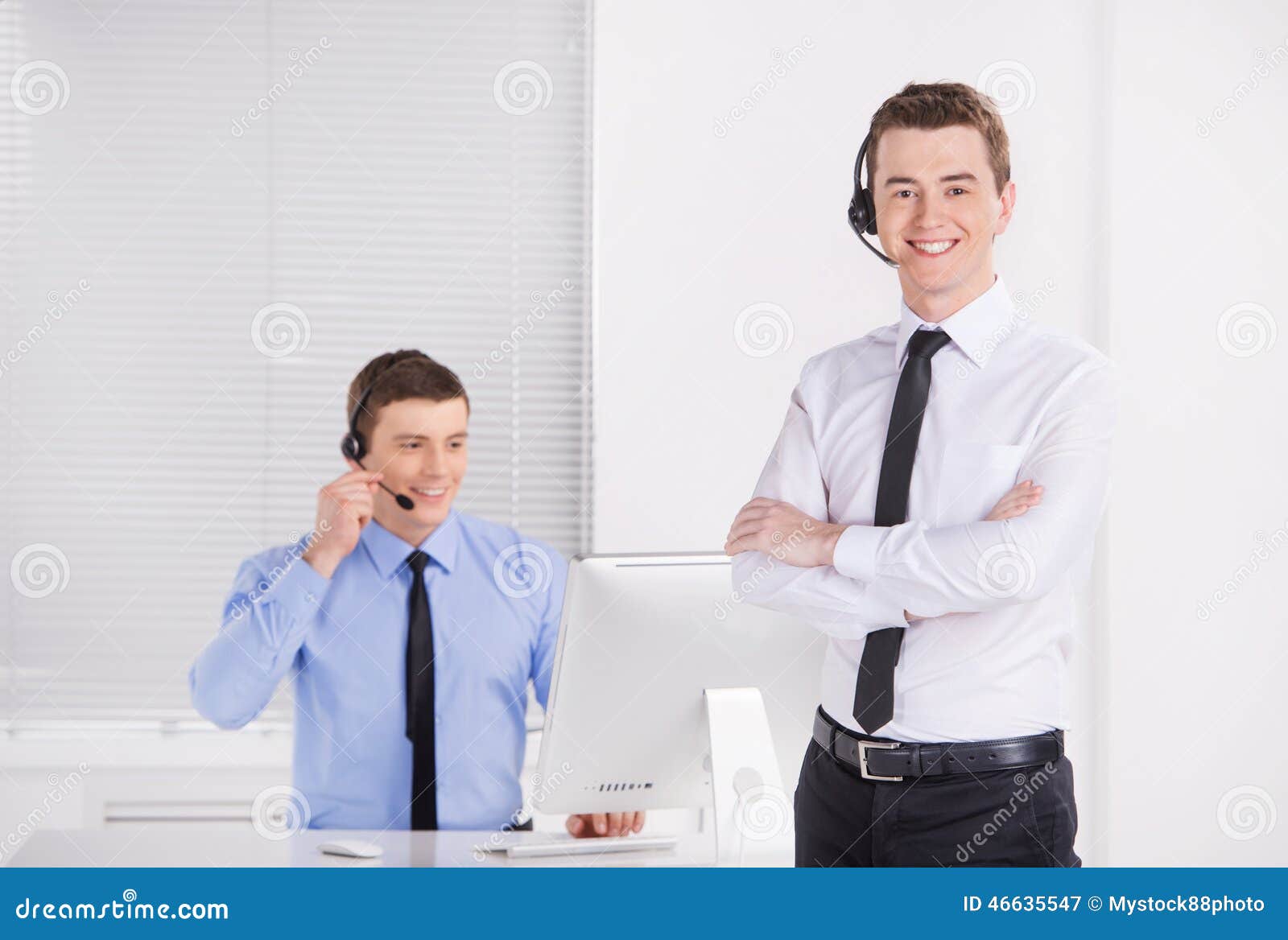 Two Young Call Center Men Talking by Phone. Stock Image - Image of ...