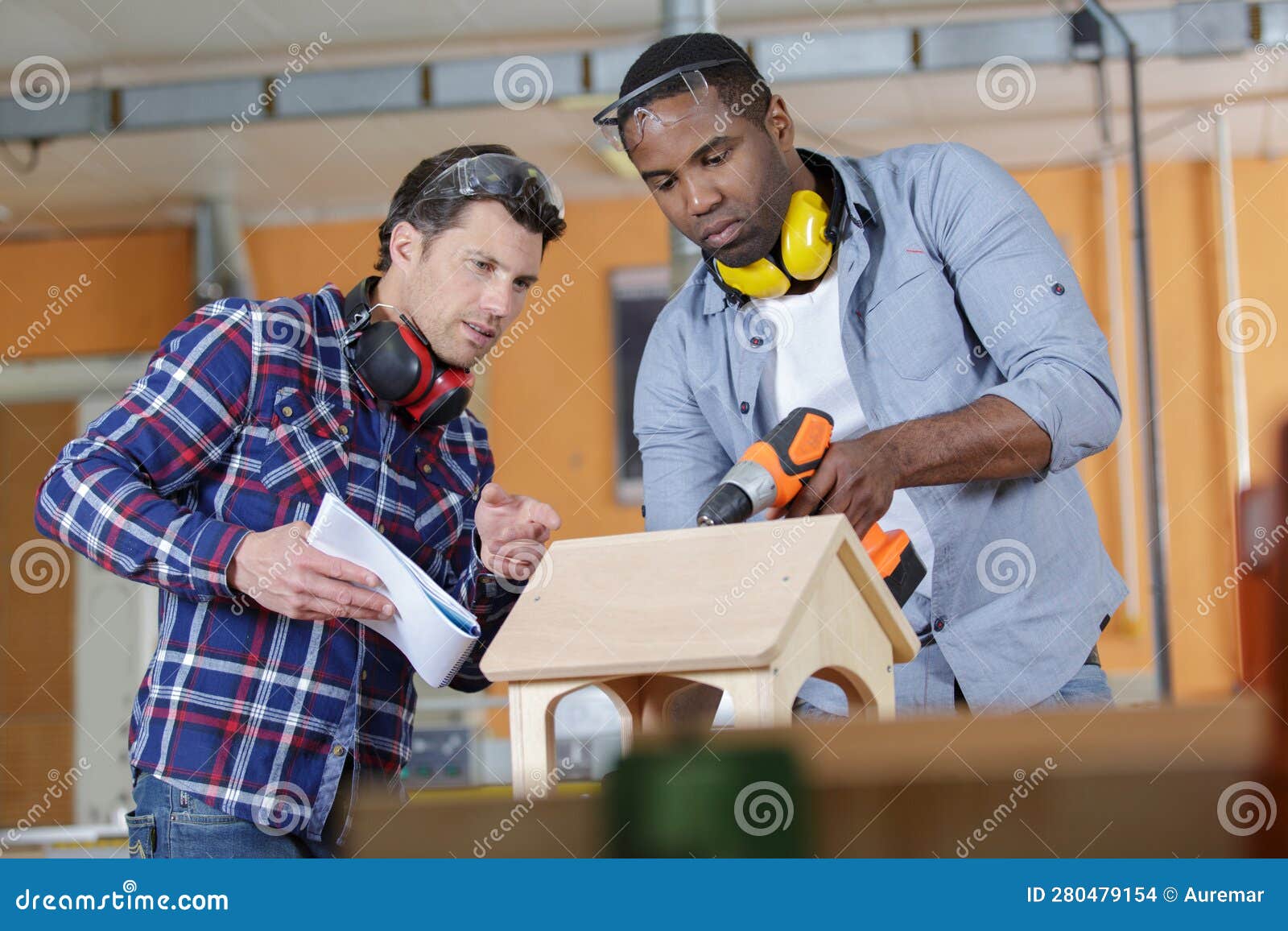 Two Young Carpenters Working in Shop Stock Photo - Image of woodworker ...