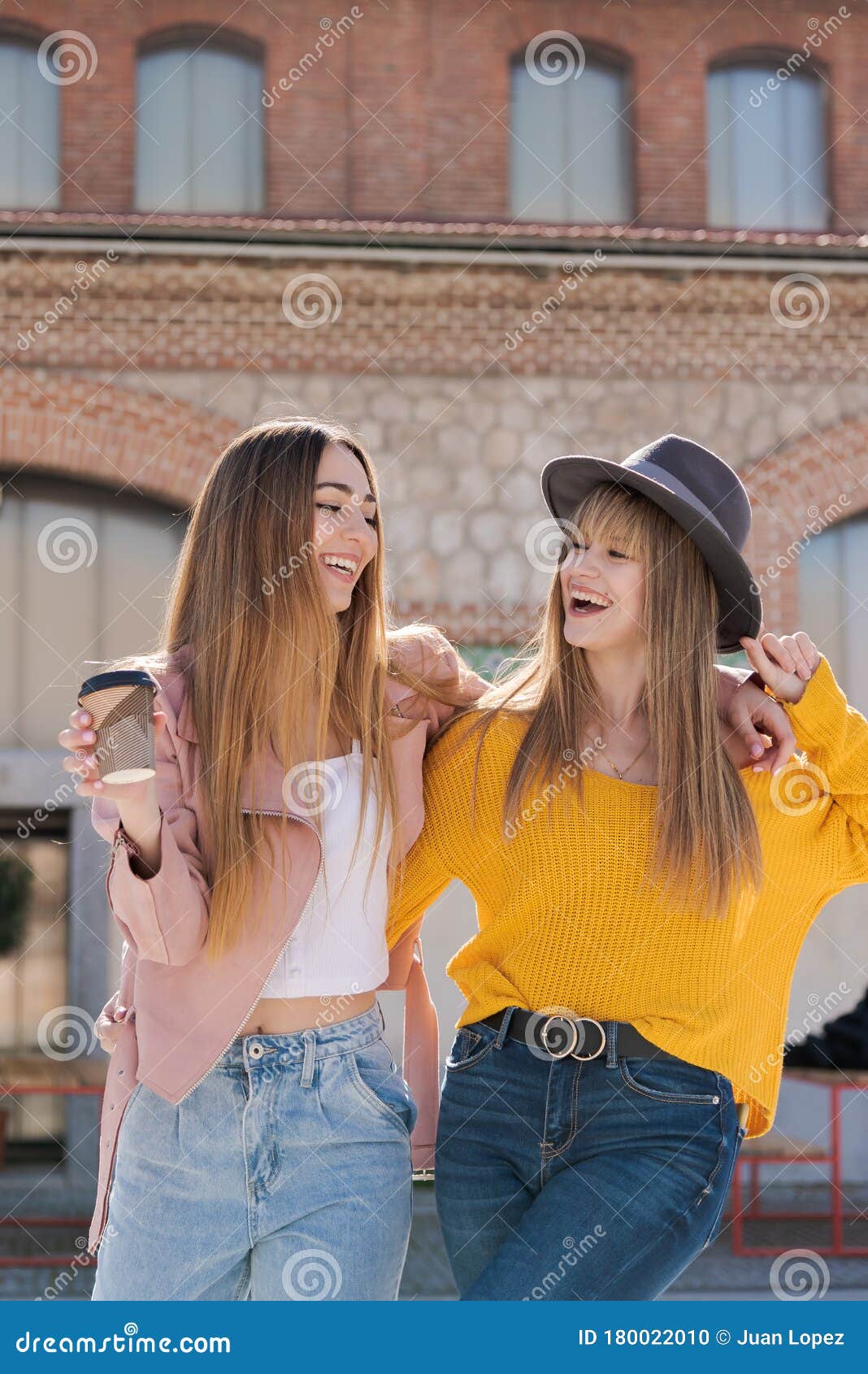 Two Young Girls Smiling and Happy on the Street in the Sunlight Stock ... Two Young Girls Smiling and Happy on the Street in the Sunlight Stock ...