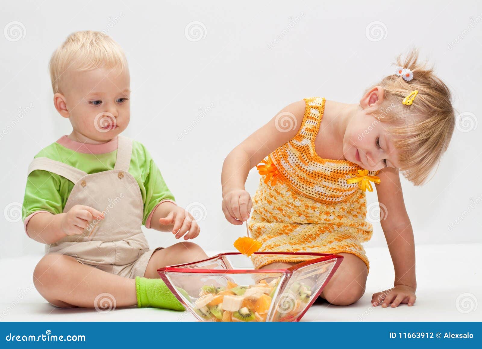 Two Young Children Eating Fruits Stock Photo - Image of dishware, food ...