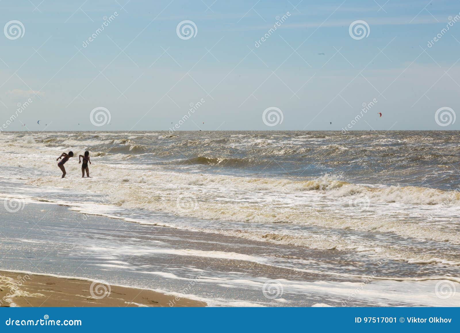 Two Young Children Enjoy the Waves during a Storm at Sea Stock Image ...