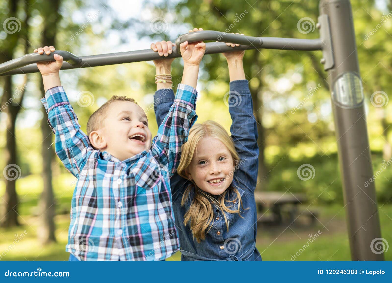 The Two Young Children Having Fun on the Playground Stock Photo - Image ...