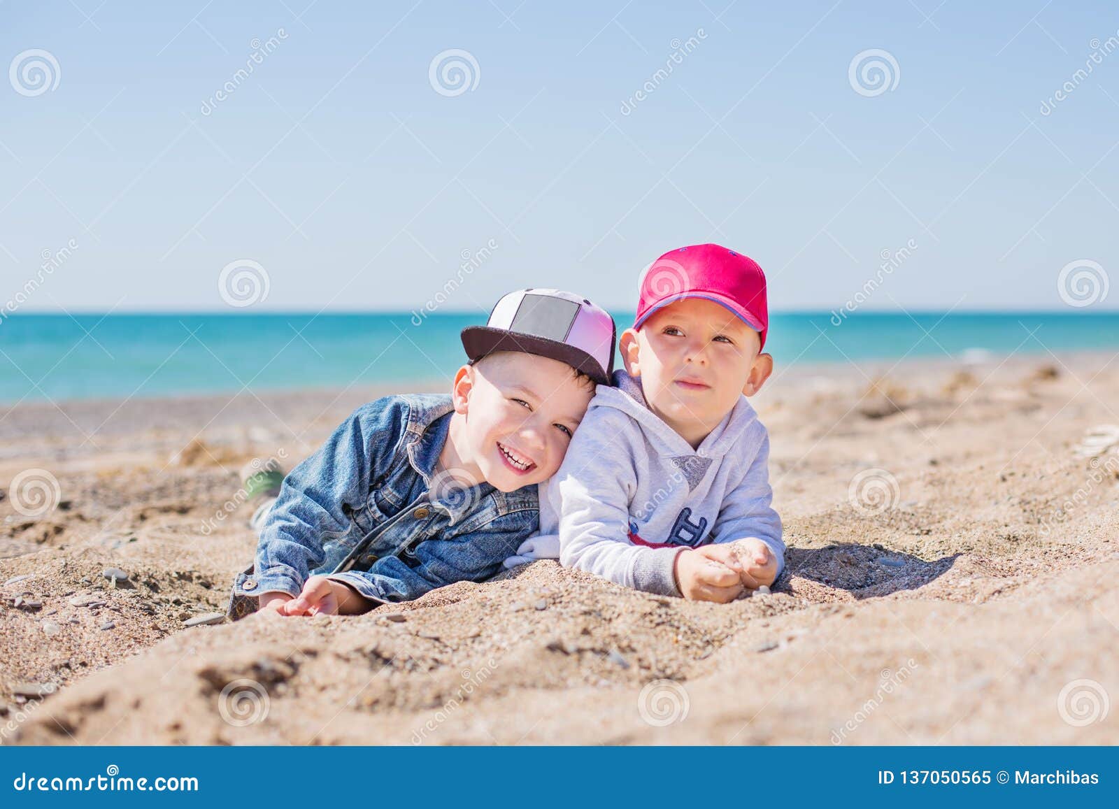 Two Young Children Playing in the Sand Stock Image - Image of beautiful ...