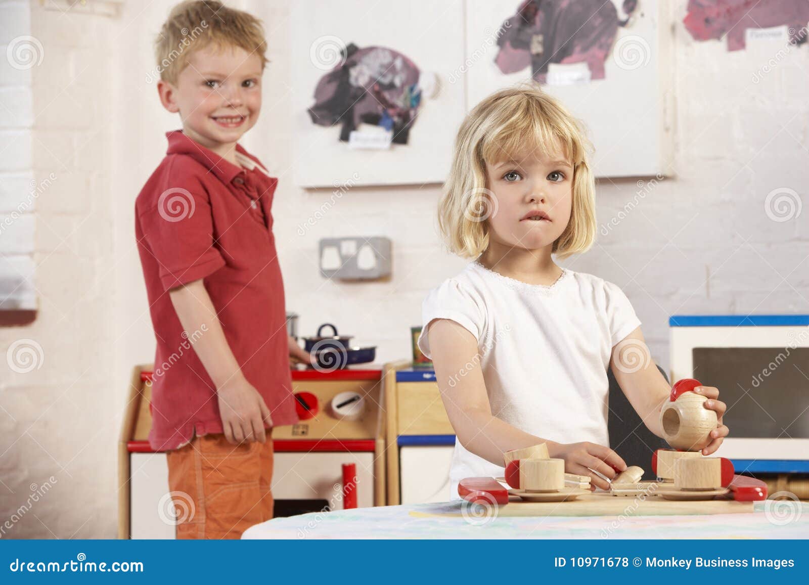 Two Young Children Playing Together at Montessori/ Stock Photo - Image ...