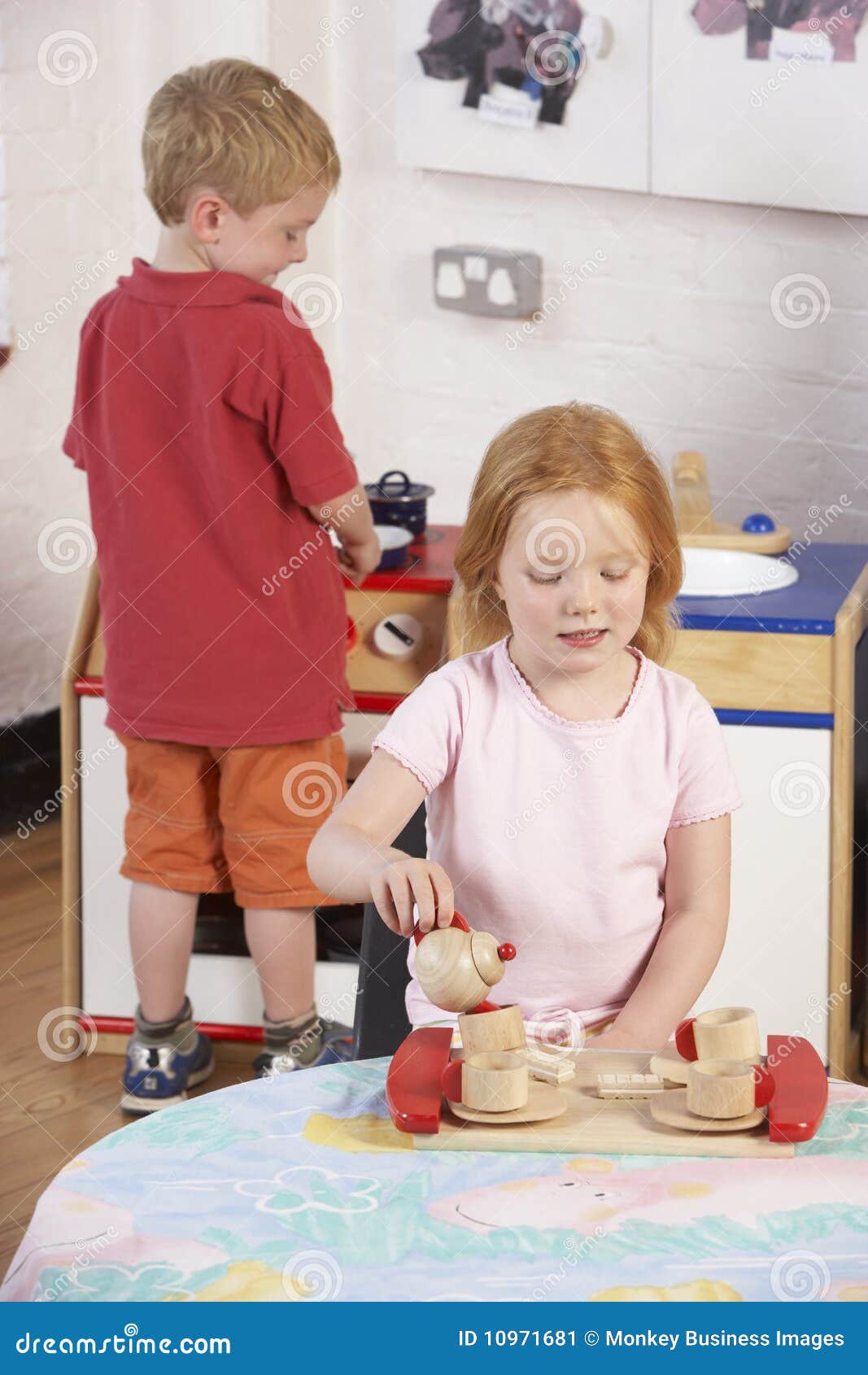 Two Young Children Playing Together at Montessori/ Stock Image - Image ...