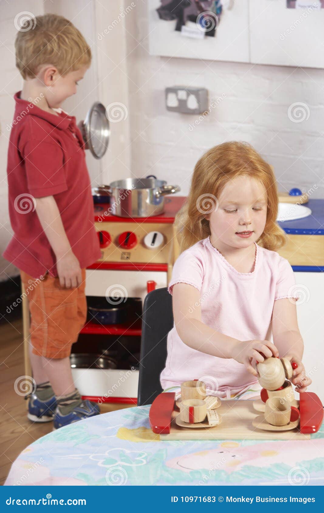 Two Young Children Playing Together at Montessori/ Stock Image - Image ...