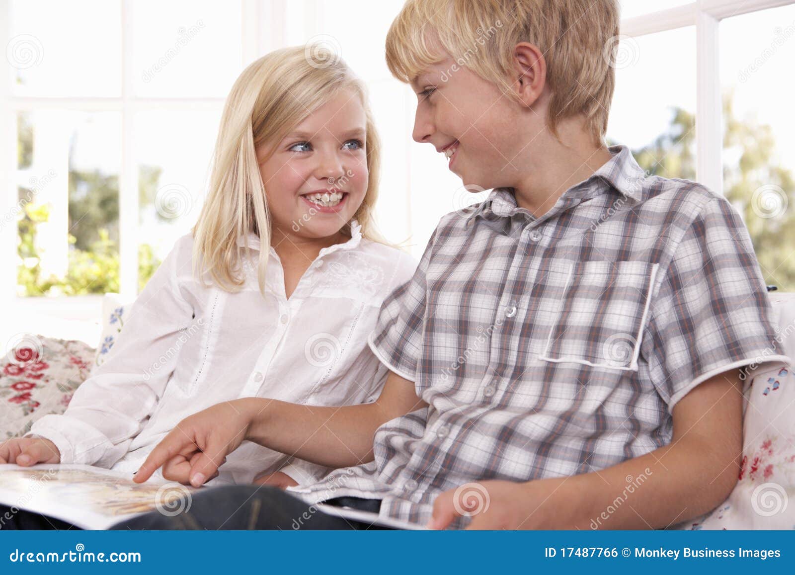 Two Young Children Read Together Stock Photo - Image of indoors, seven ...