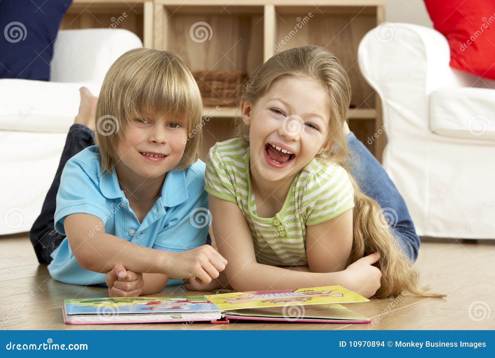 Two Young Children Reading Book at Home Stock Photo - Image of relaxed ...