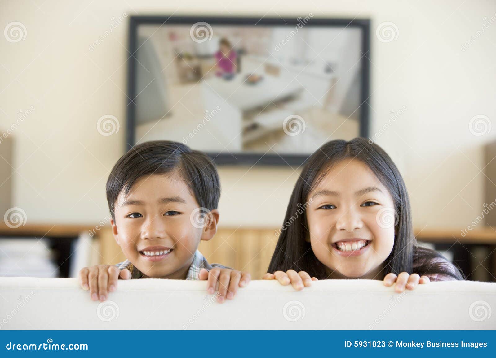 Two Young Children in Room with Flat Screen Stock Image - Image of ...