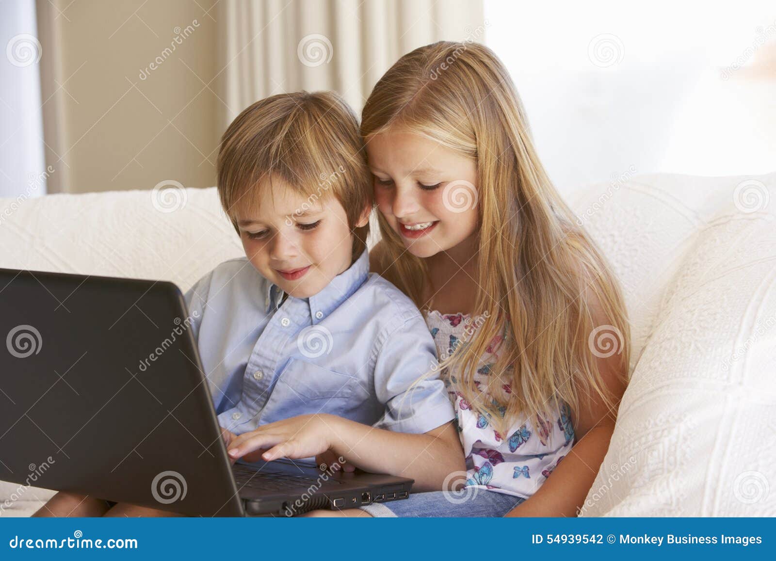 Two Young Children Using Laptop at Home Stock Photo - Image of nine ...
