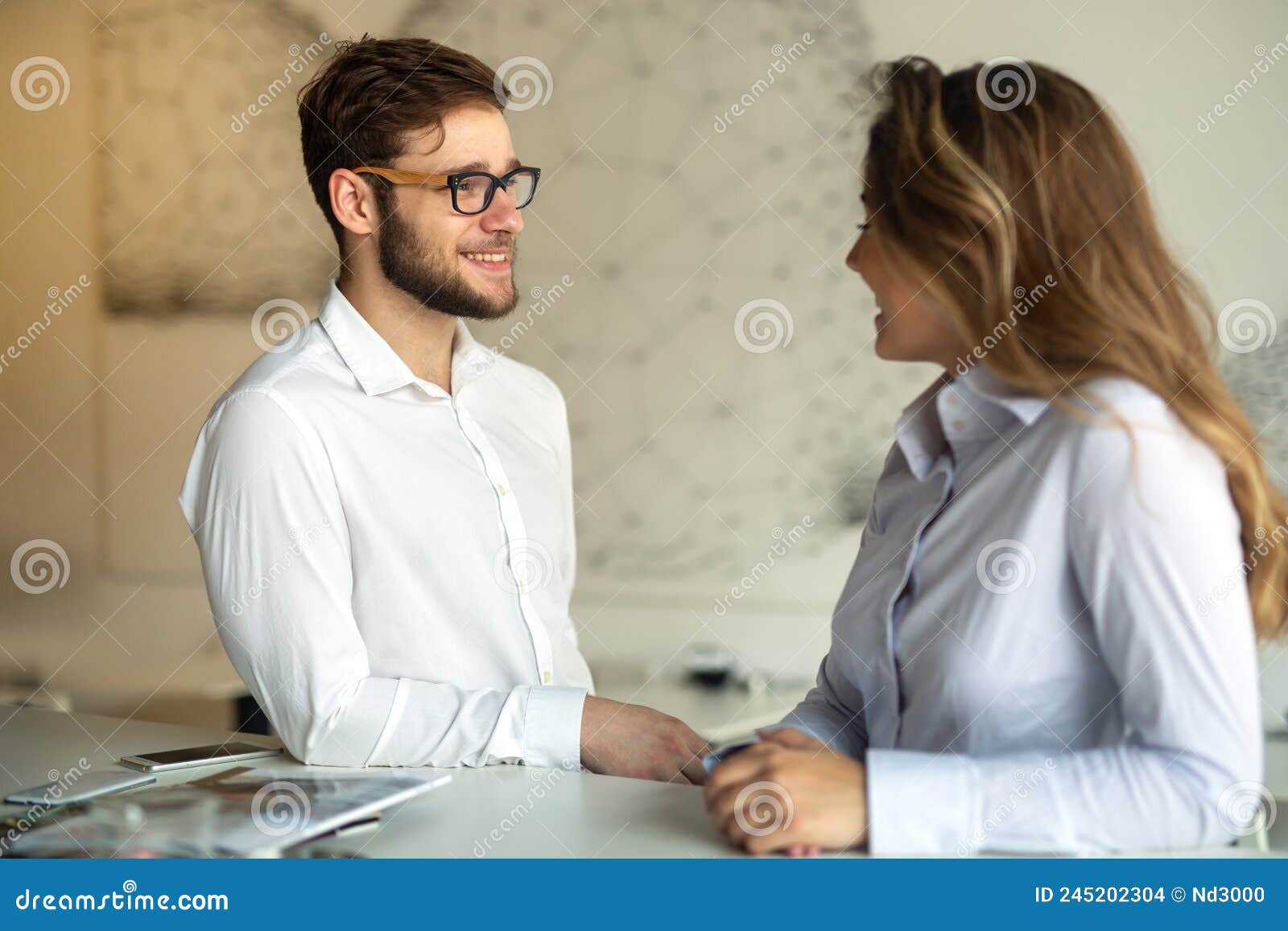 Two Young Colleagues Chatting Together on a Break Stock Photo - Image ...