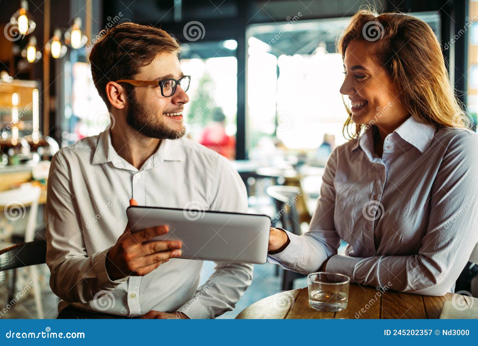 Two Young Colleagues Chatting Together on a Break Stock Image - Image ...