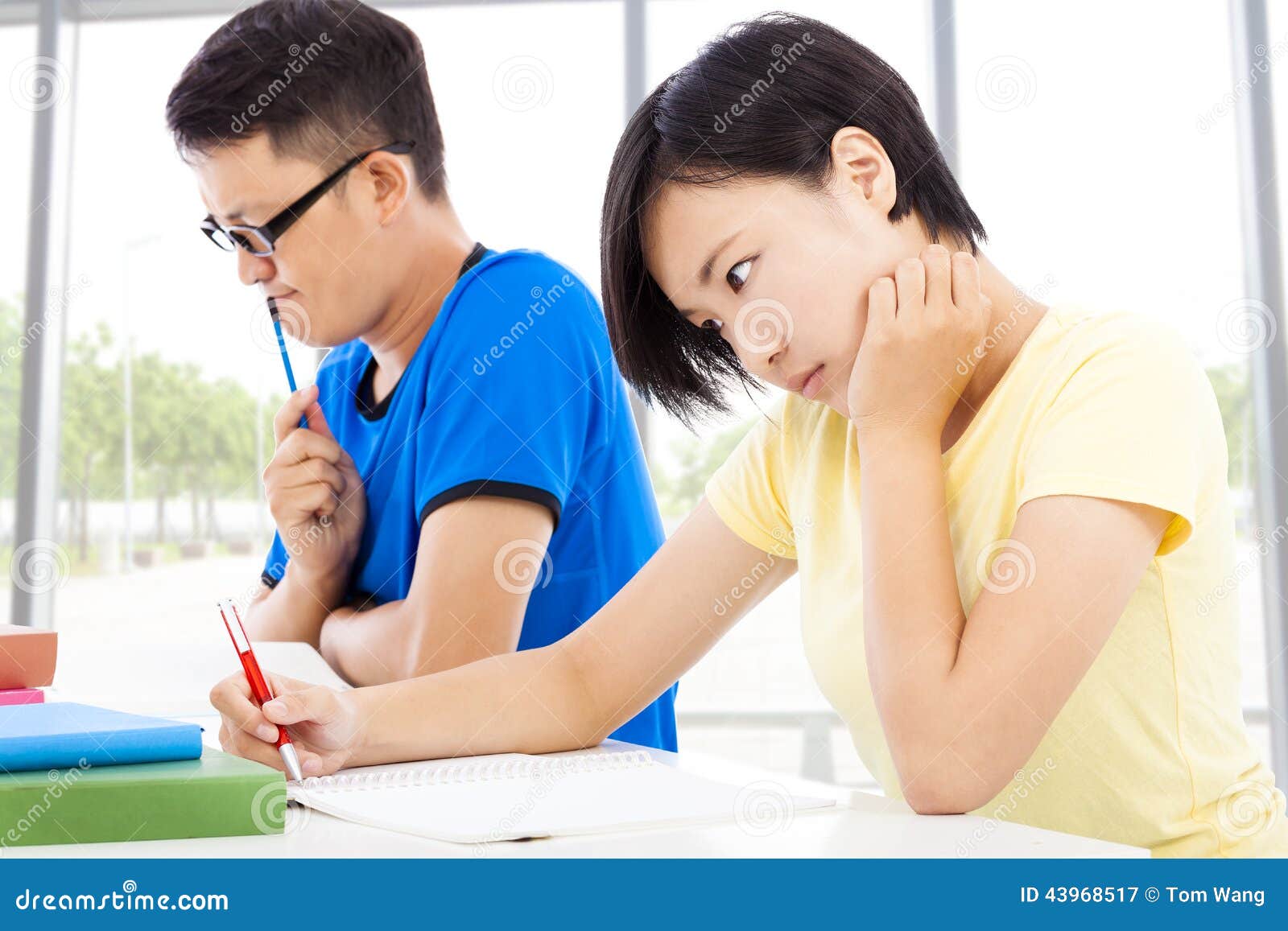 Two Young College Students Sitting an Exam Stock Image - Image of ...