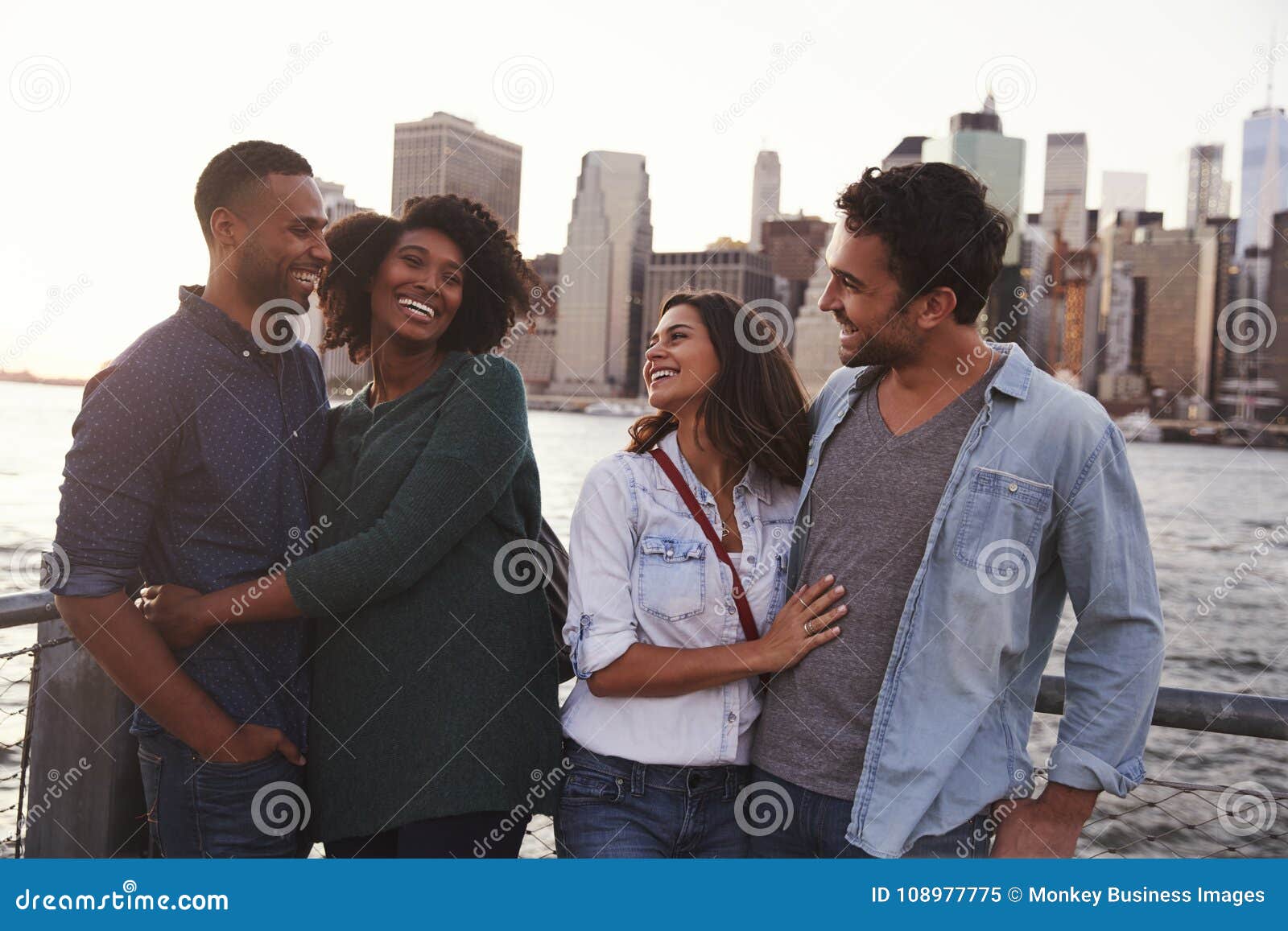 Two Young Couples Standing on Quayside, Front View Stock Image - Image ...