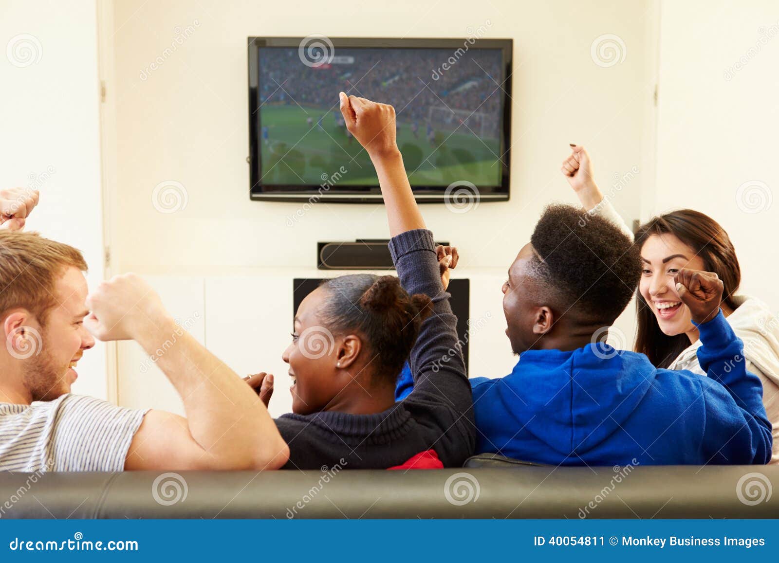 Two Young Couples Watching Television at Home Together Stock Image ...