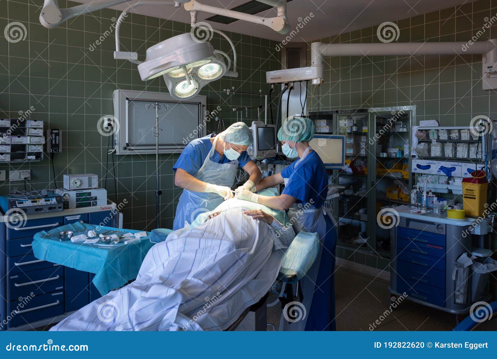 2 Young Doctors Perform an Operation in an Operating Theatre Editorial ...