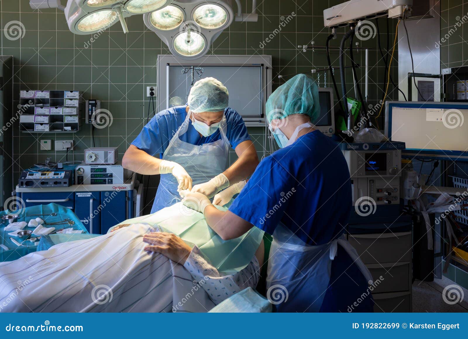 2 Young Doctors Perform an Operation in an Operating Theatre Editorial ...