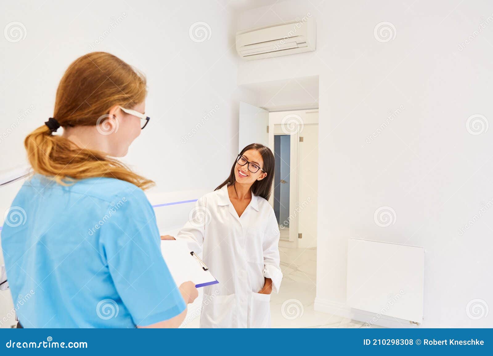 Two Young Doctors Work Together As a Team Stock Photo - Image of ...