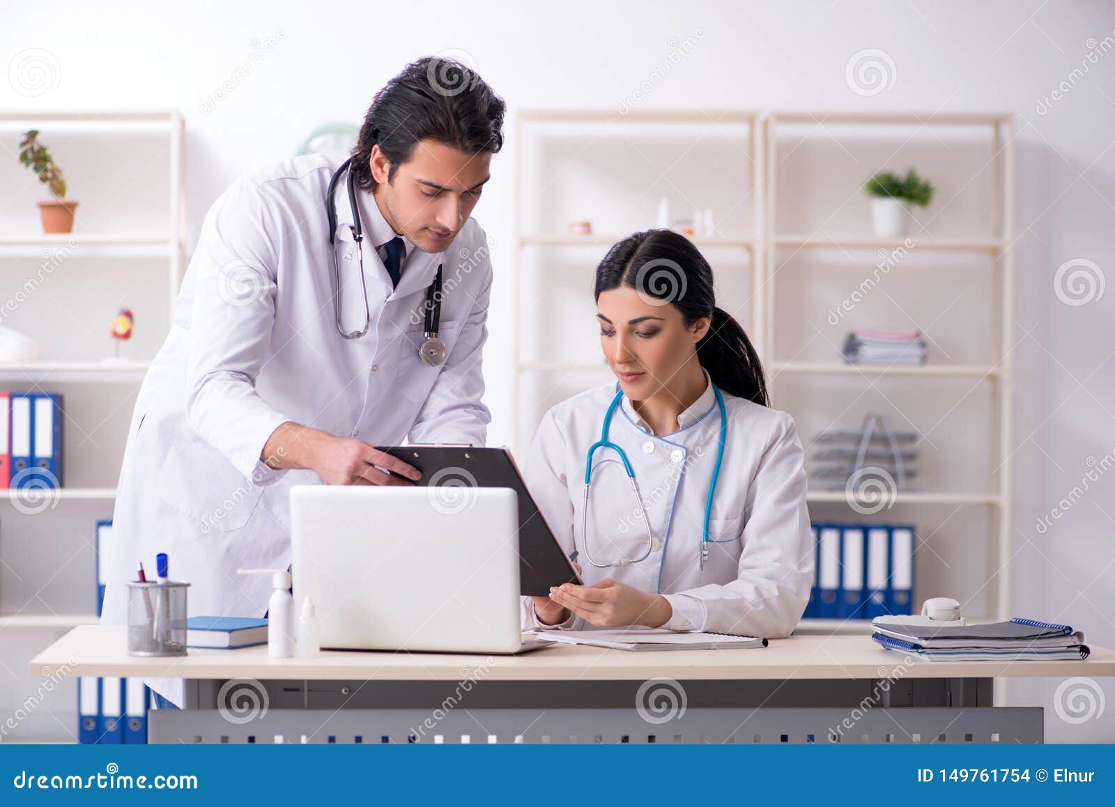 Two Young Doctors Working in the Clinic Stock Photo - Image of ...