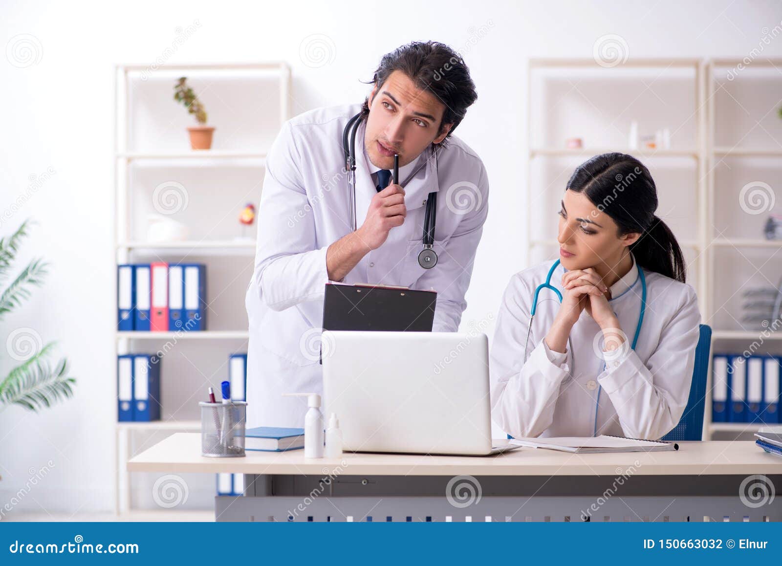 The Two Young Doctors Working in the Clinic Stock Photo - Image of ...