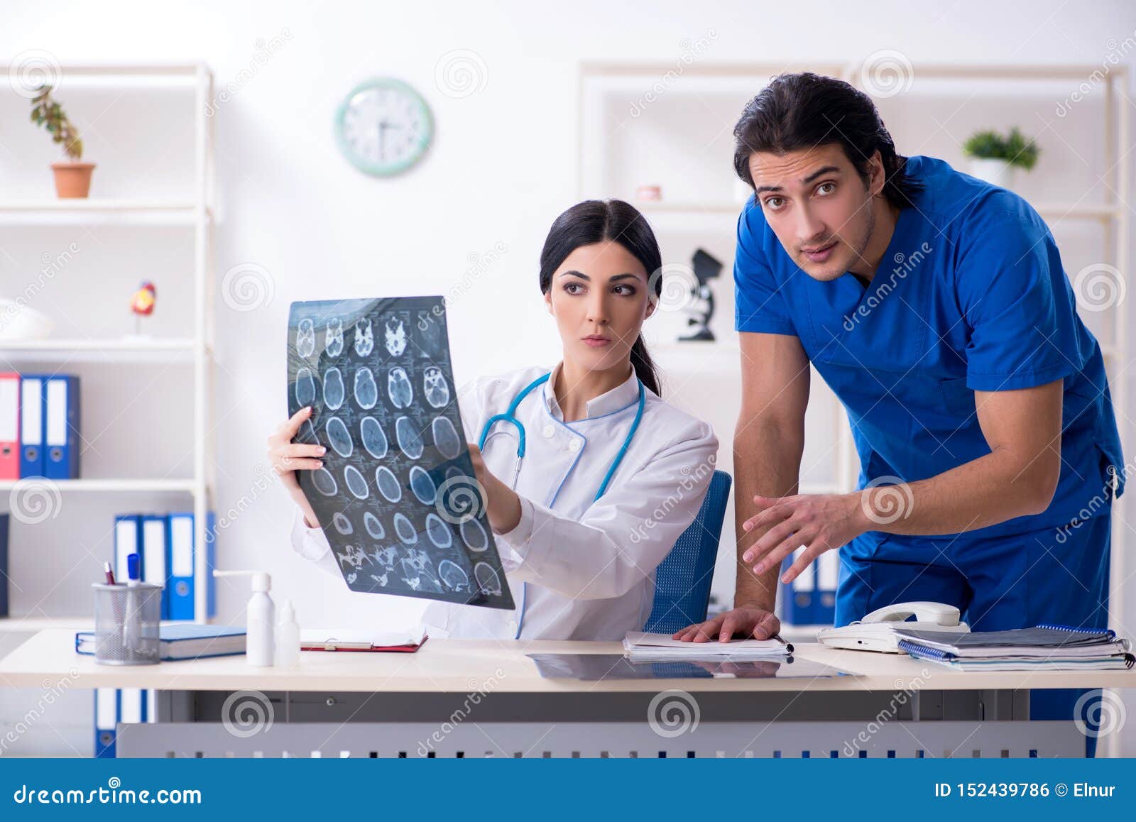 Two Young Doctors Working in the Clinic Stock Photo - Image of doctor ...