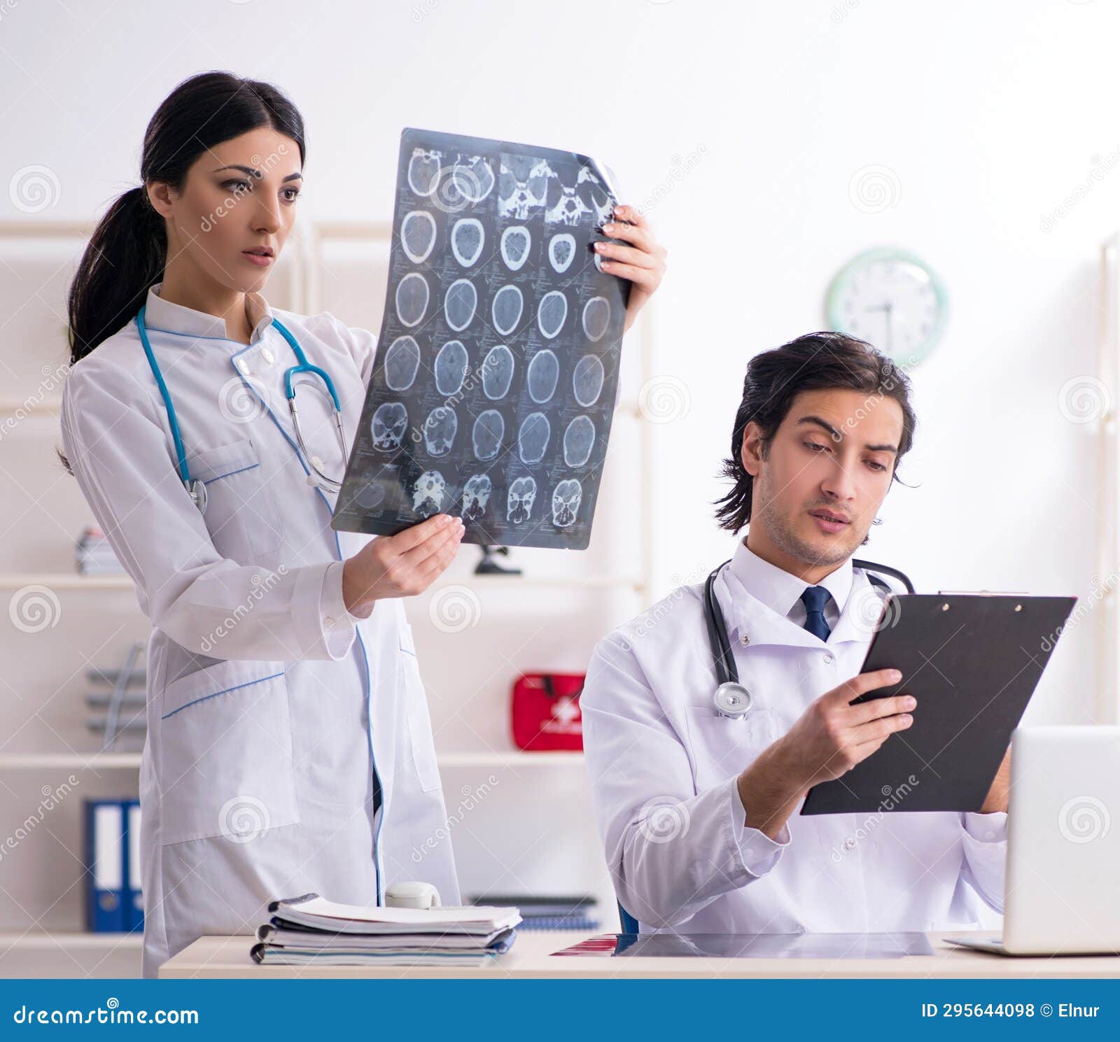 Two Young Doctors Working in the Clinic Stock Photo - Image of disease ...