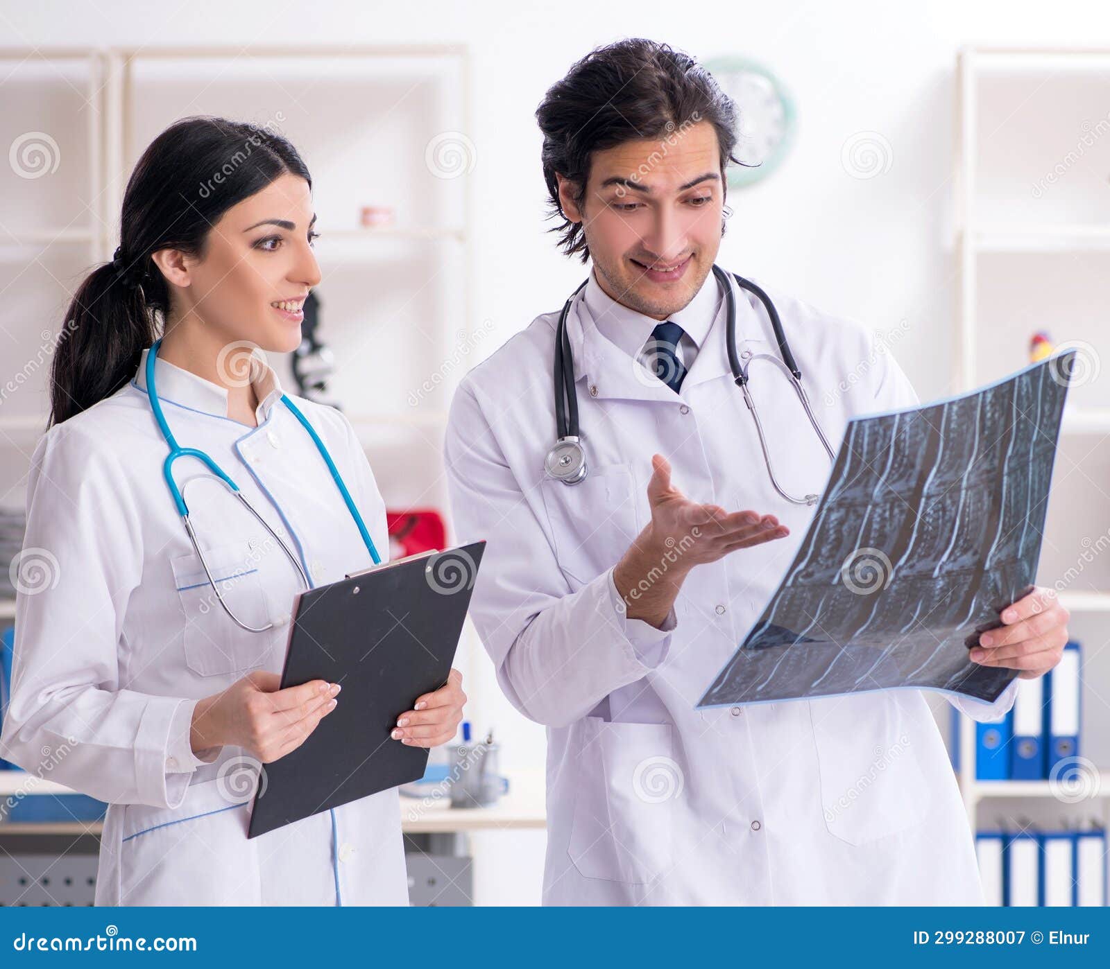 Two Young Doctors Working in the Clinic Stock Image - Image of ...