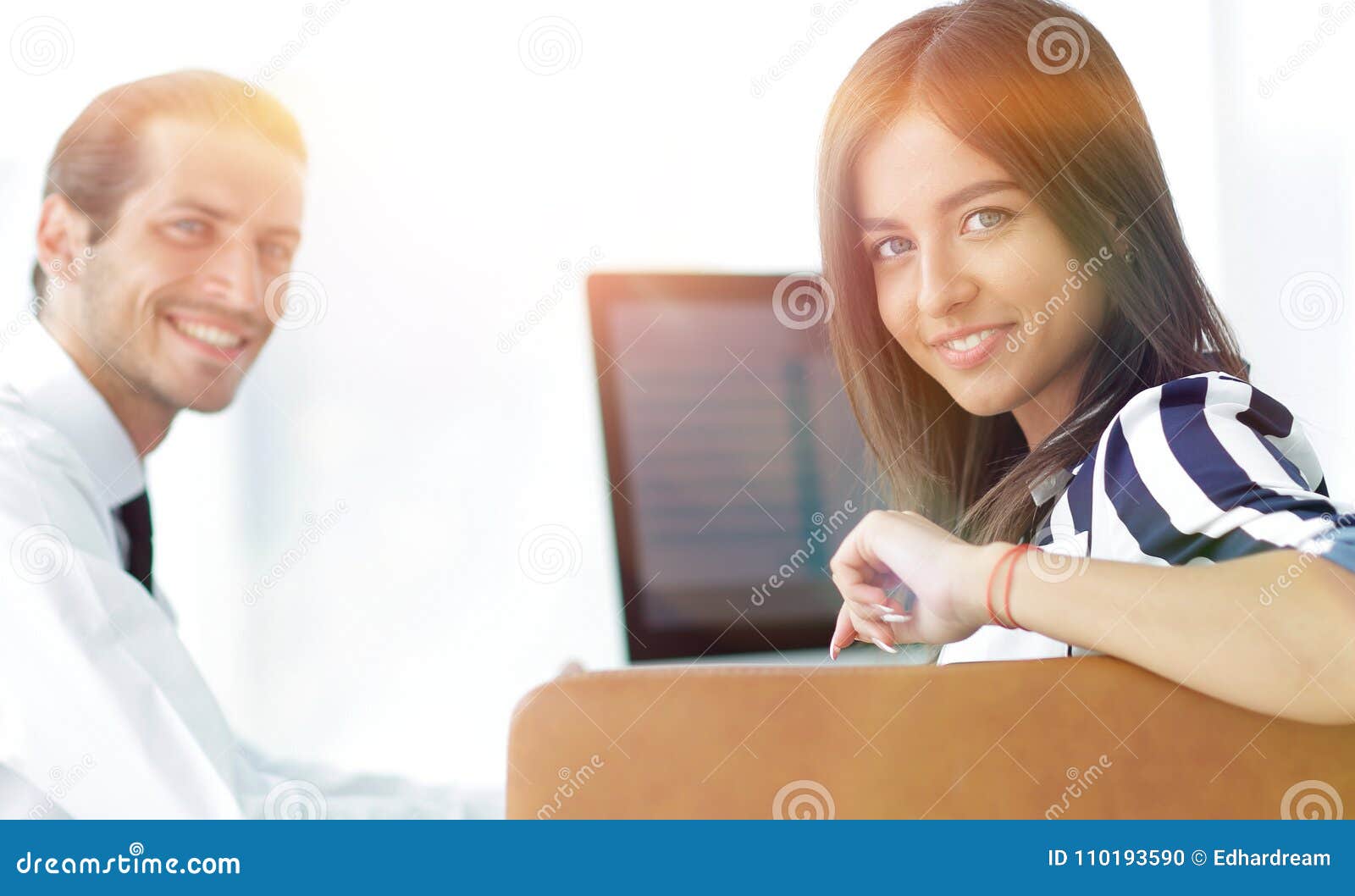 Two Young Employee Sitting Behind a Desk Stock Photo - Image of ...