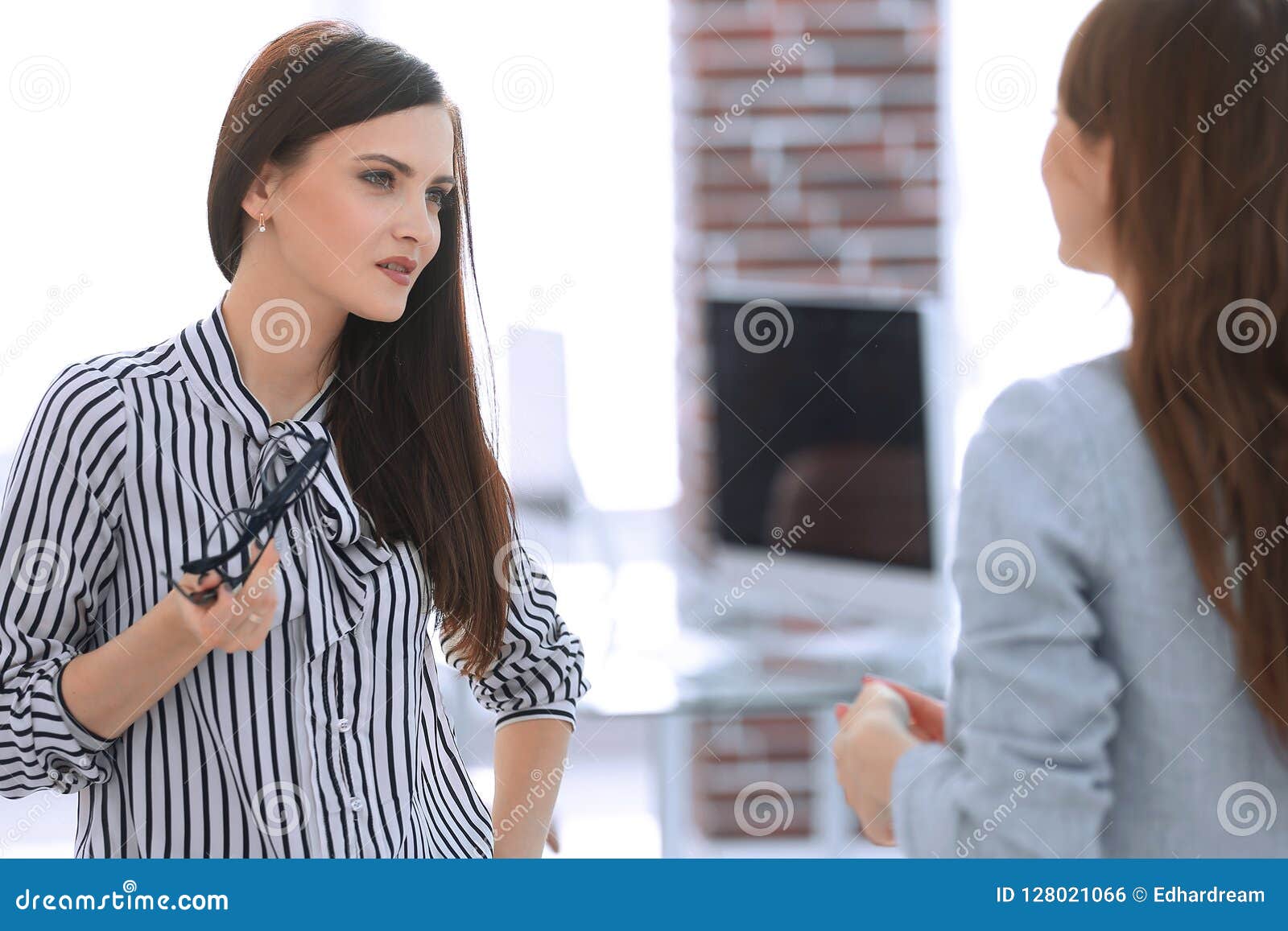 Two Young Employees are Talking in the Office. Stock Photo - Image of ...