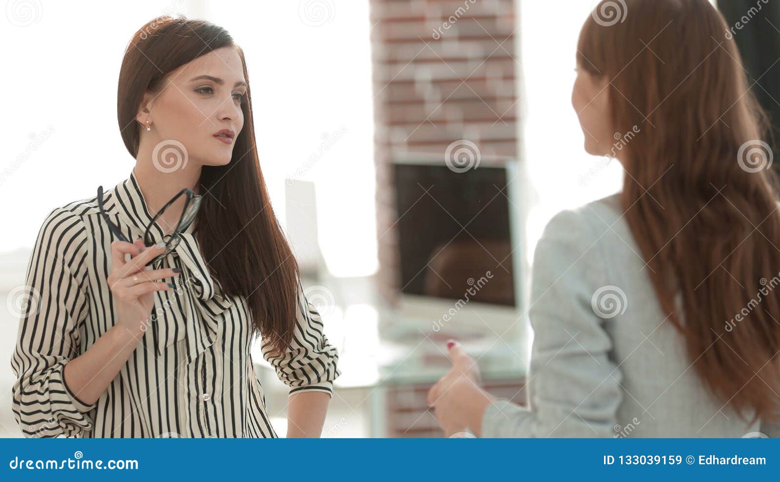 Two Young Employees are Talking in the Office. Stock Image - Image of ...