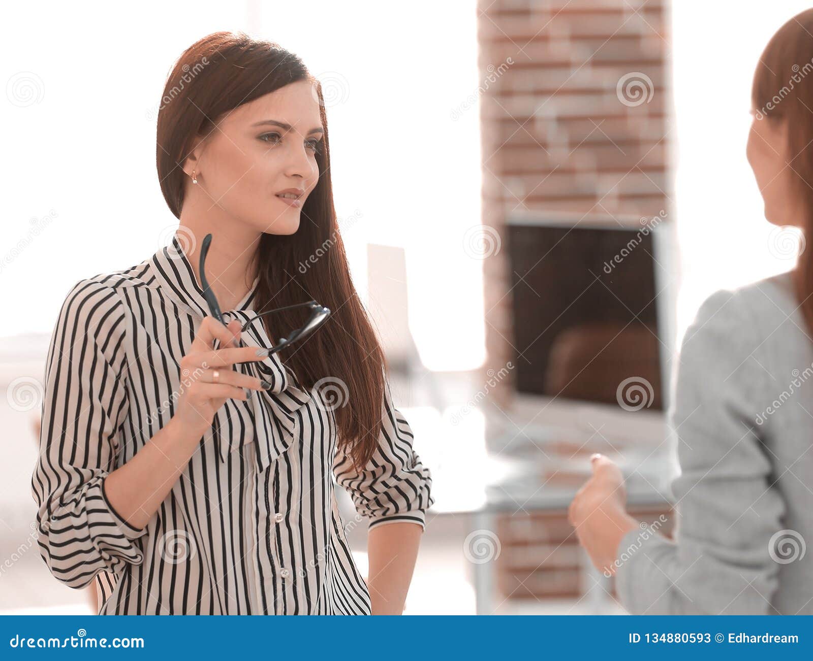 Two Young Employees are Talking in the Office. Stock Image - Image of ...