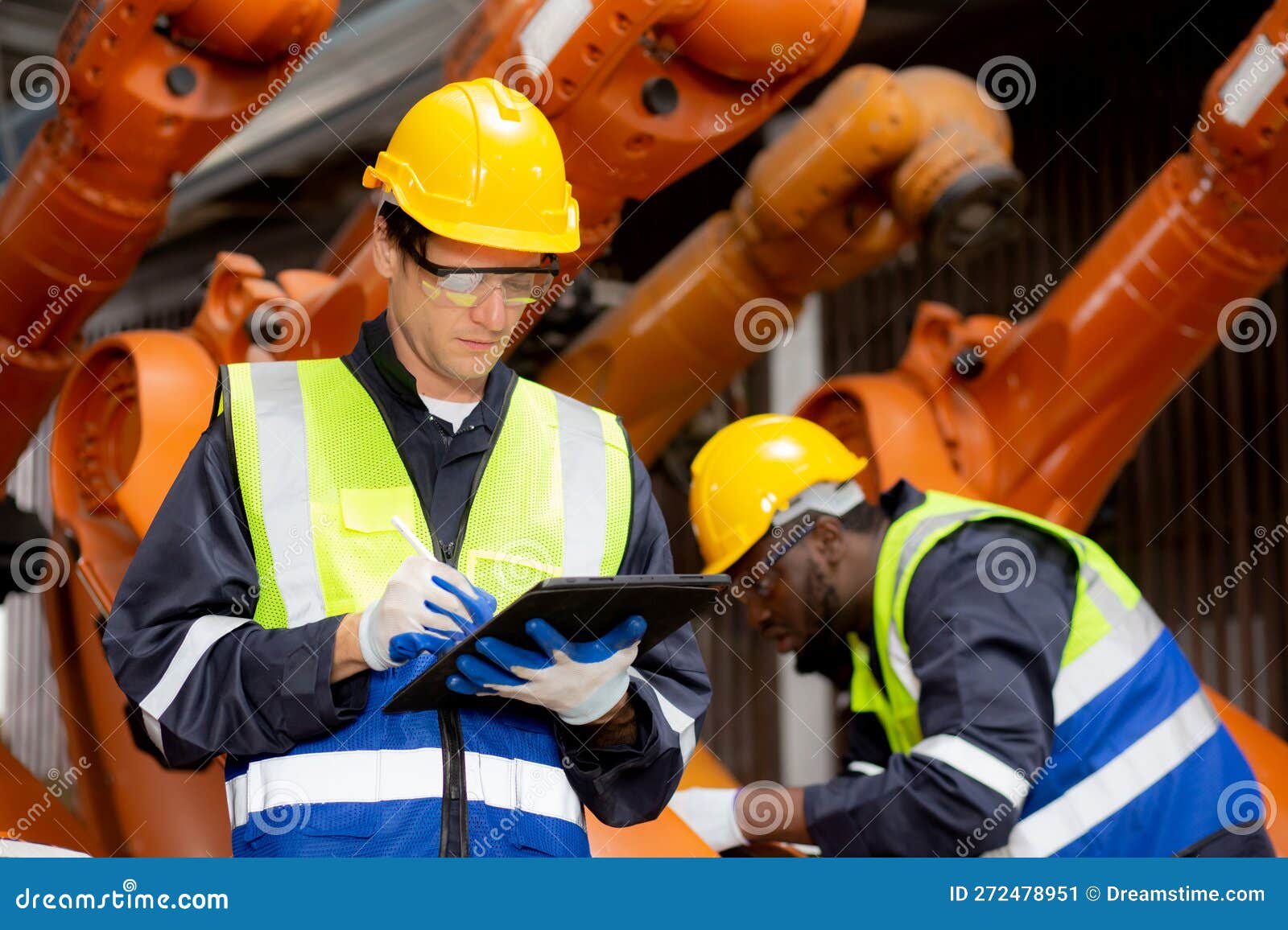 Two Young Engineer Man Checking and Maintenance Machine Robot Arms ...