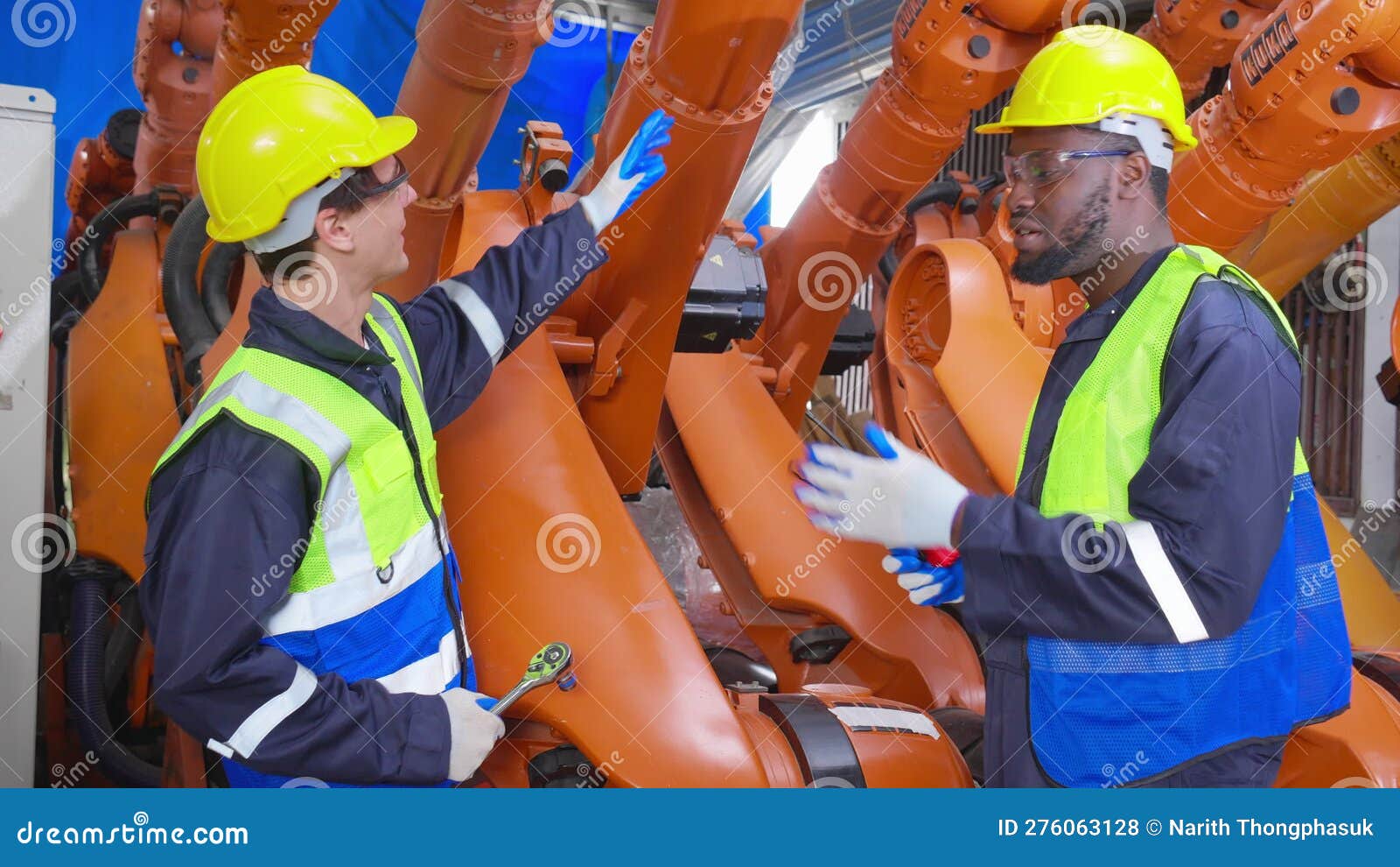 Two Young Engineer Man Meeting and Explaining about Robot Arms ...