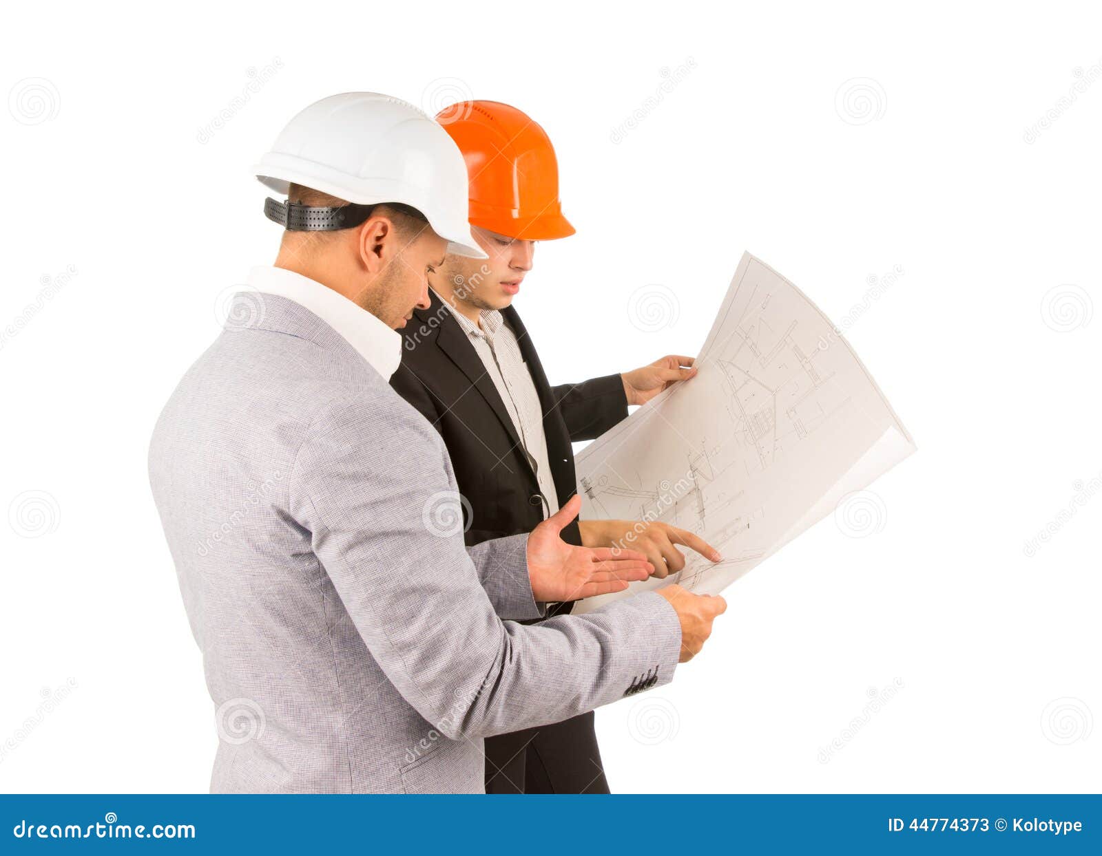Two Young Engineers Discussing a Building Plan Stock Image - Image of ...