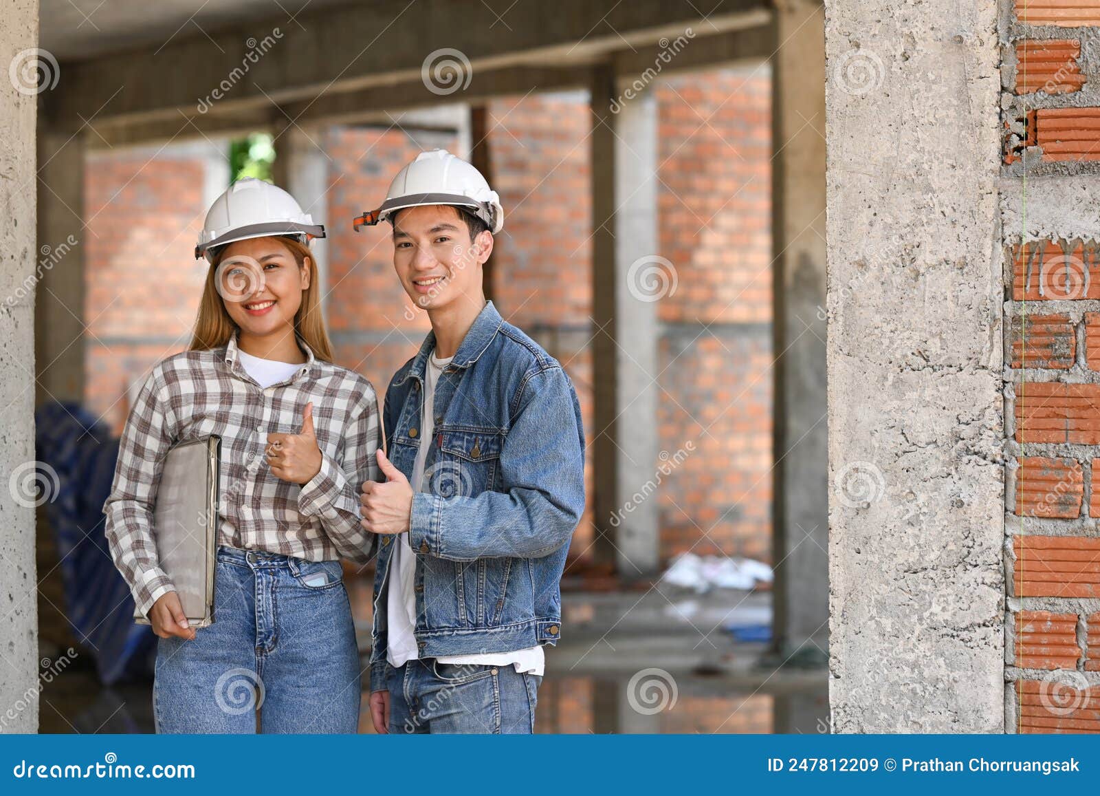 Two Young Engineers Wearing Safety Helmet Standing Construction Site ...