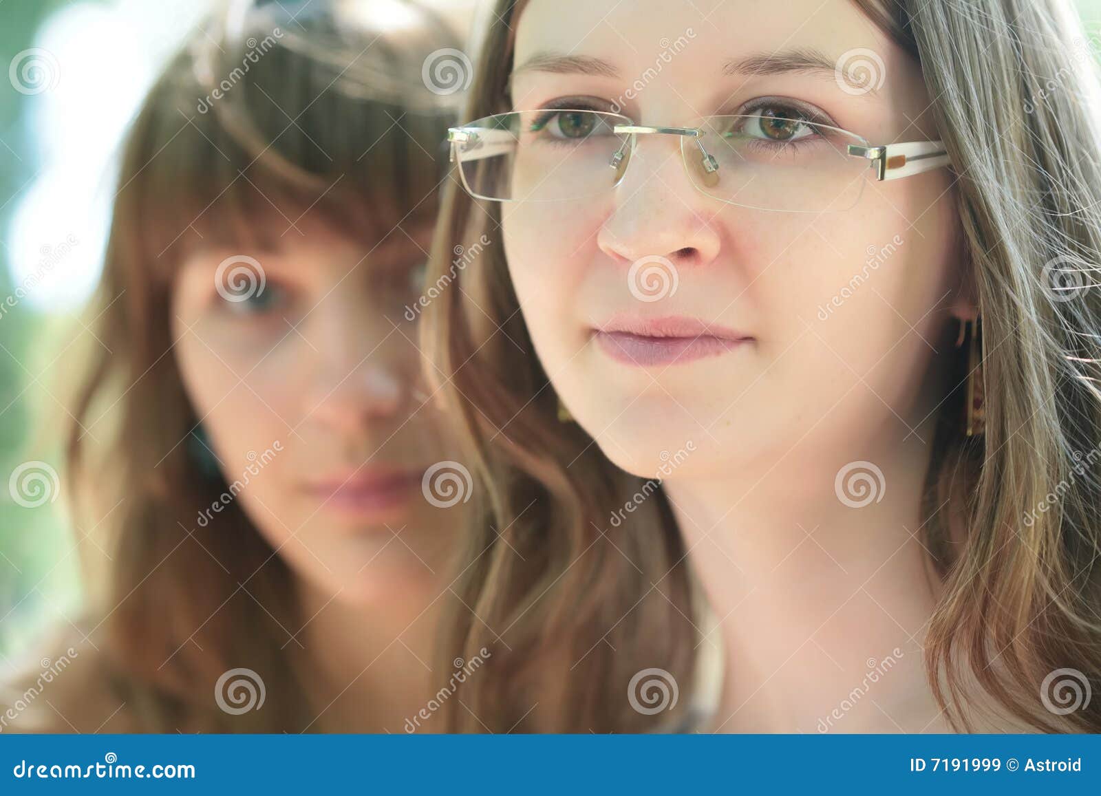 Two young faces stock image. Image of lips, closeup, green - 7191999
