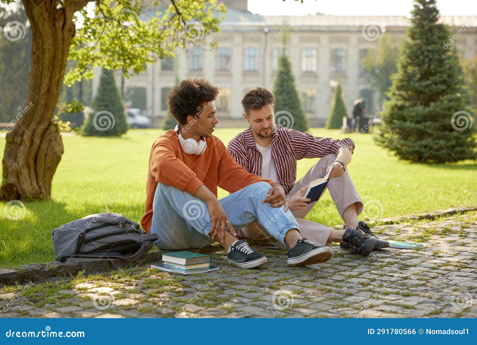 Two Young Fellow Students Talking Together Discussing Ideas Stock Photo ...