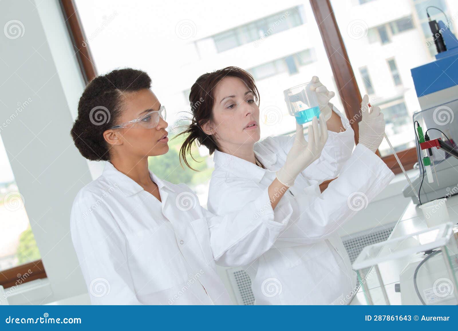 Two Young Female Scientist Doing Experiments in Lab Stock Image - Image ...