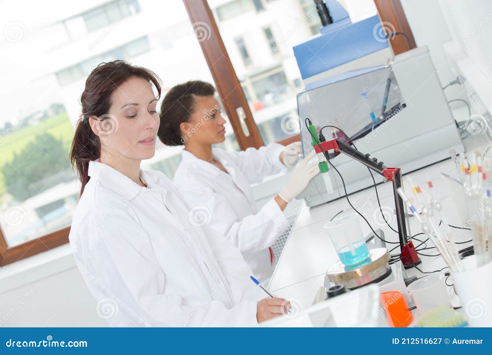 Two Young Female Scientist Doing Experiments in Lab Stock Image - Image ...