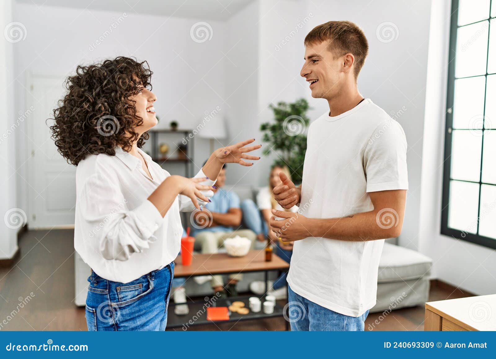 Two Young Friends Standing and Speaking at Home Stock Image - Image of ...