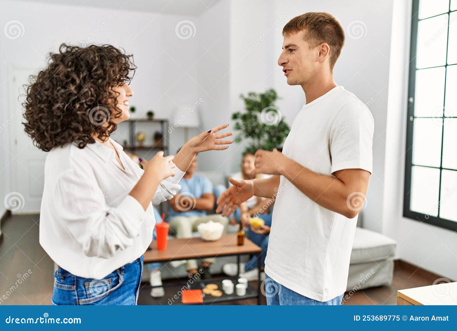 Two Young Friends Standing and Speaking at Home Stock Image - Image of ...