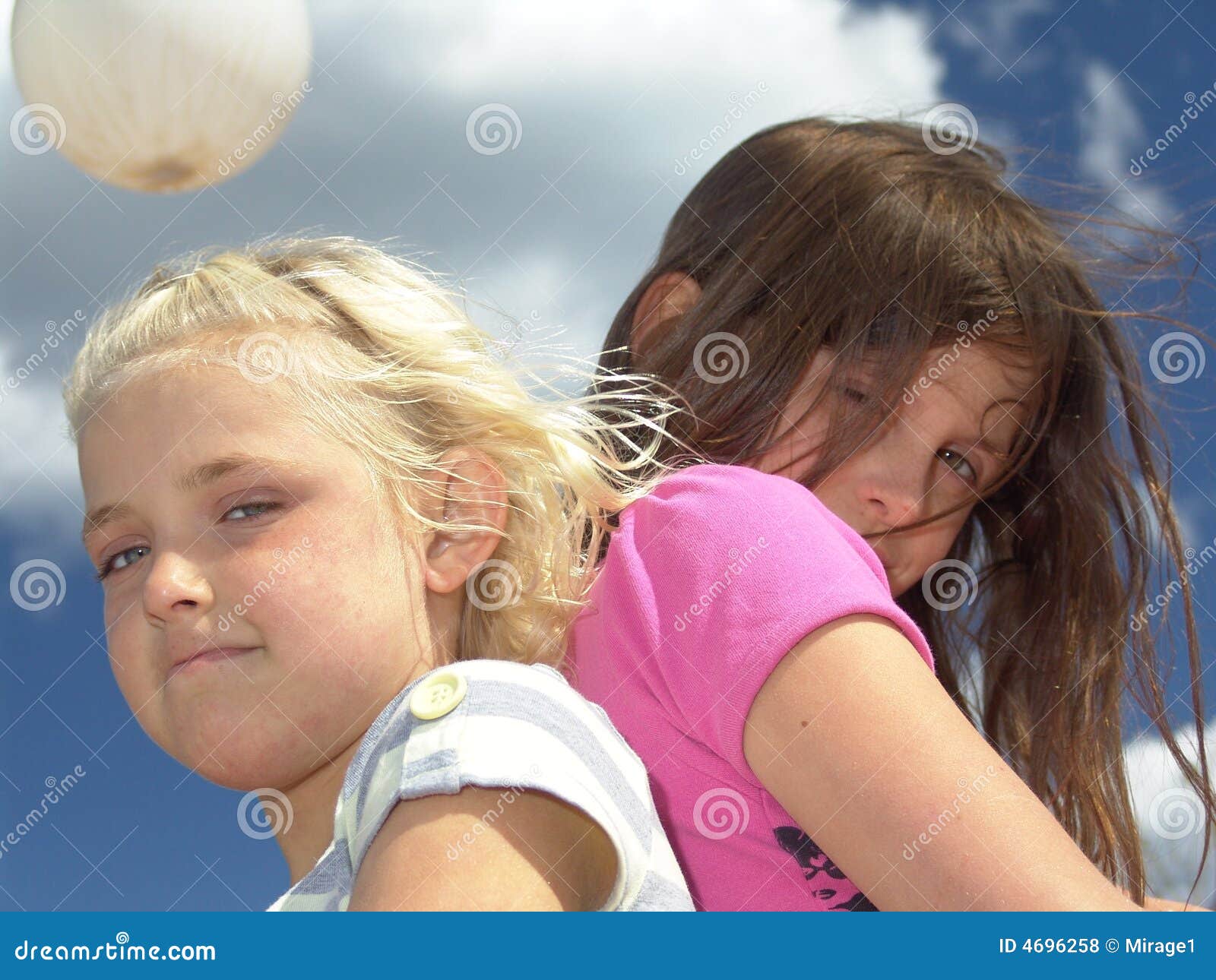 Two Young Girls Back To Back Stock Photo - Image of blond, blonde: 4696258