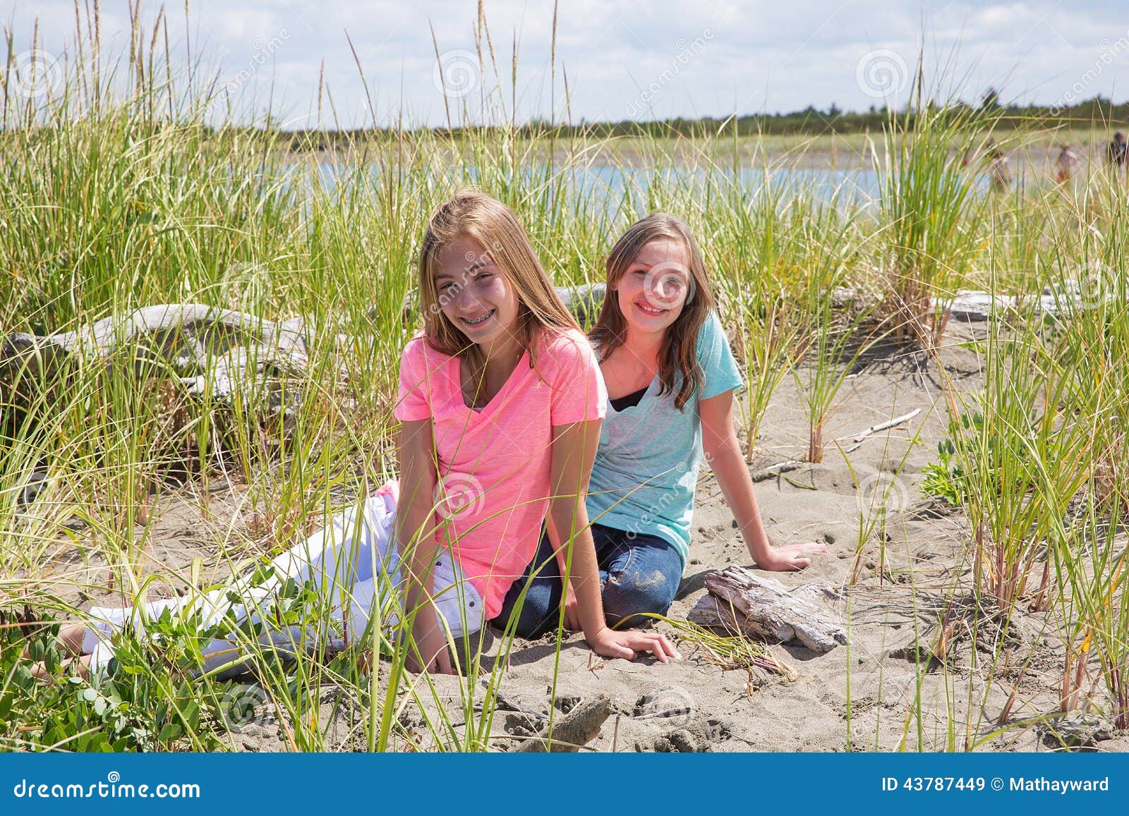 Two Young Girls at the Beach Stock Image - Image of cute, sitting: 43787449