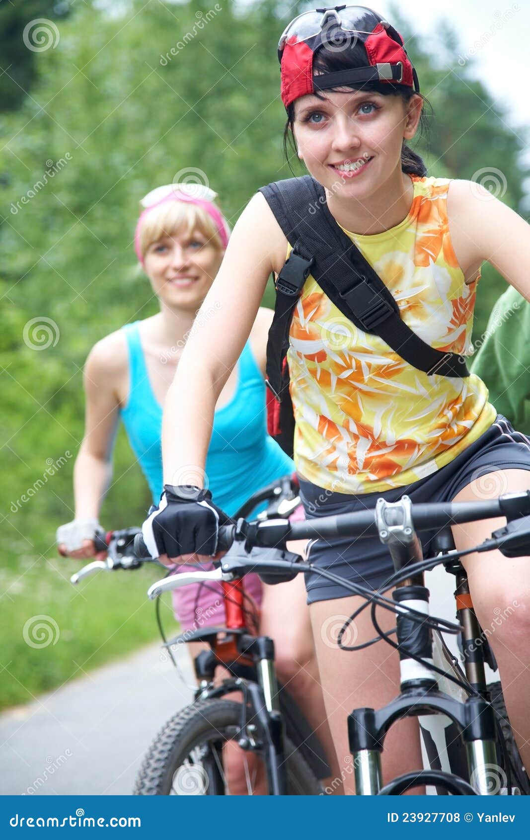 Two young girls on bicycle stock photo. Image of people - 23927708