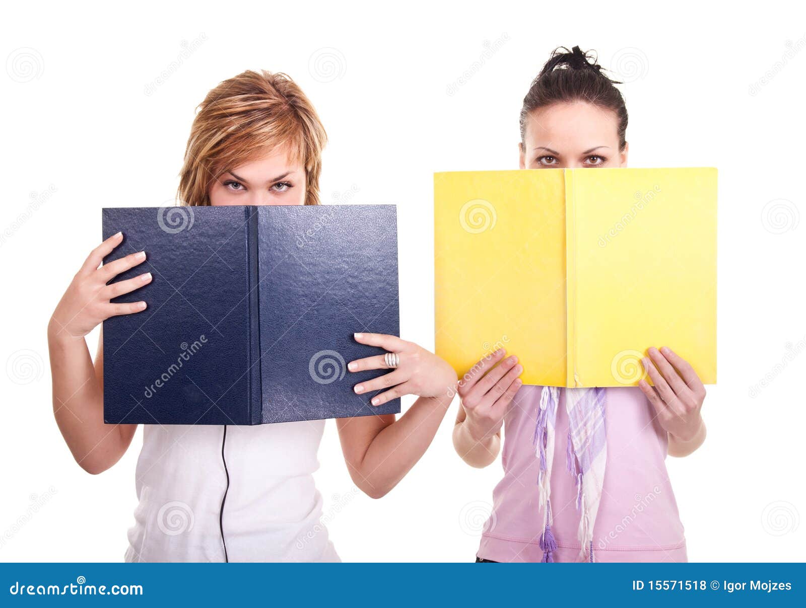 Two young girls with books stock photo. Image of friends - 15571518
