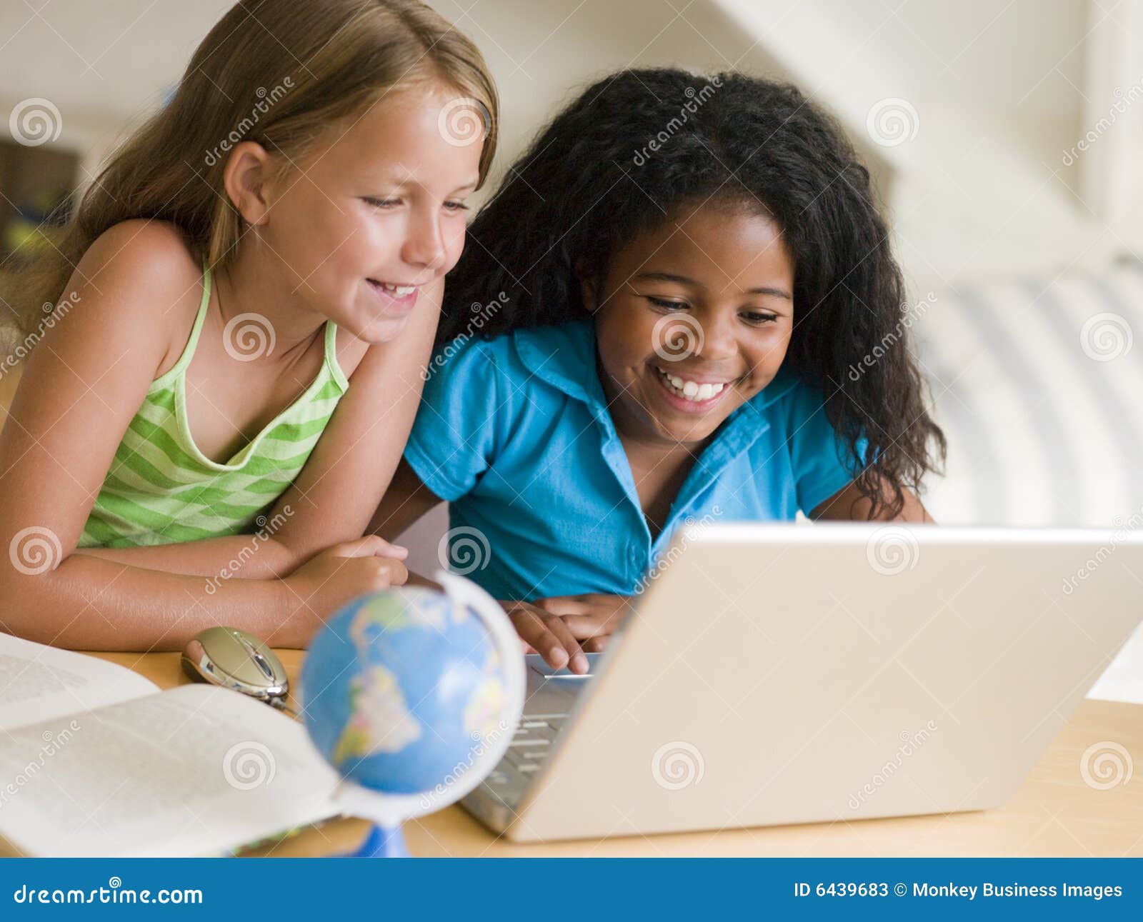Two Young Girls Doing Their Homework on a Laptop Stock Image - Image of ...