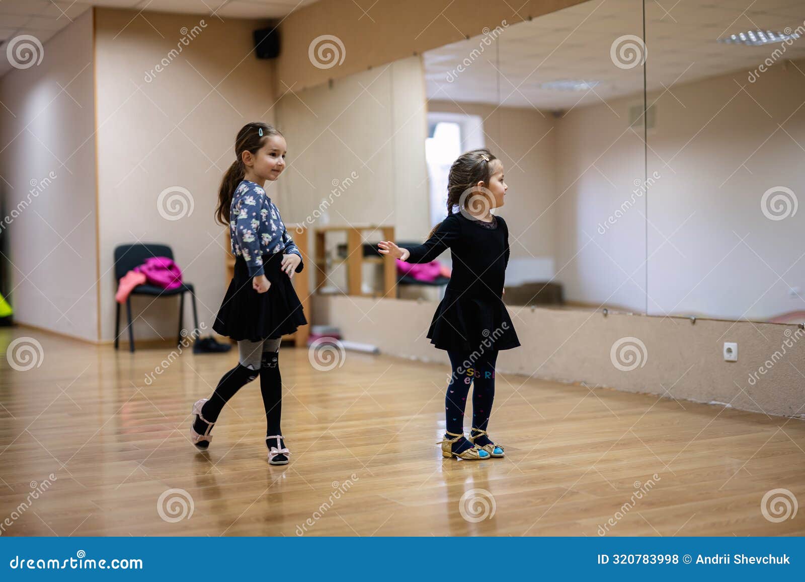 Two Young Girls Practicing Dance in Studio with Mirror Reflection Stock ...